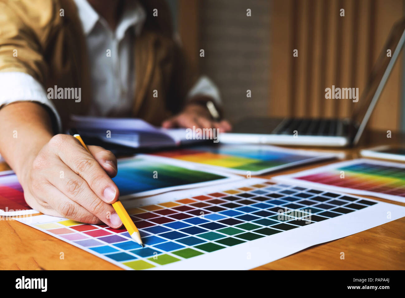 Graphic designers choose colors from the color bands samples for design ...