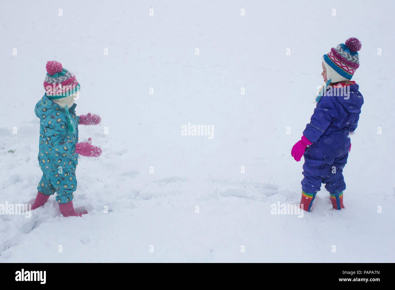 Children playing in the snow Stock Photo - Alamy