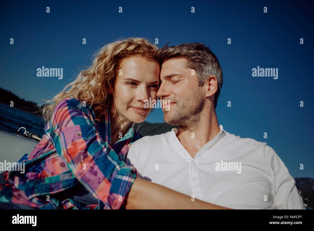 Affectionate couple on a sailing boat Stock Photo - Alamy