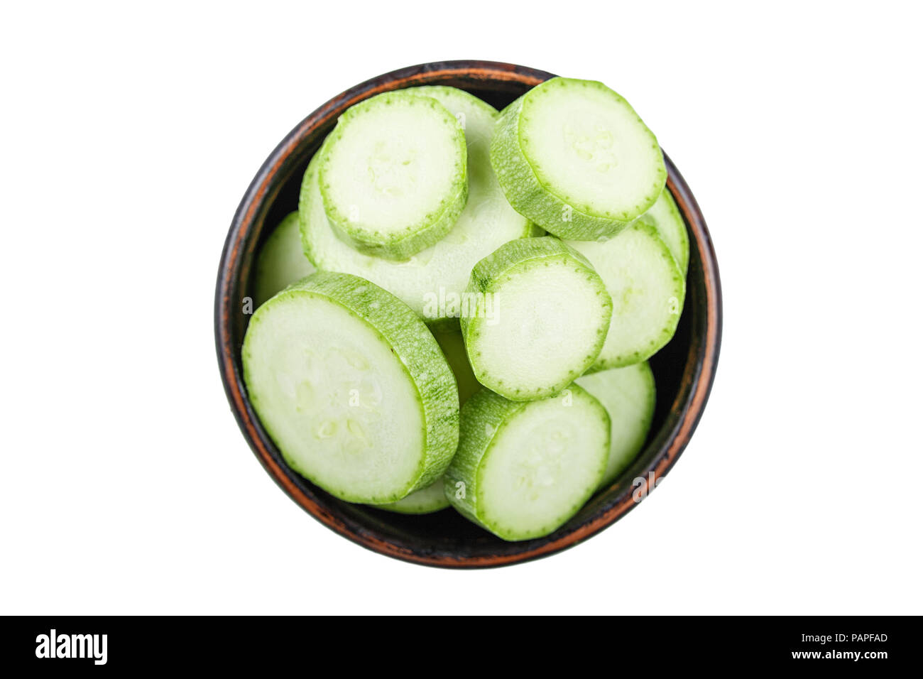 zucchini cut in circles, in a plate isolated, on white background Stock ...
