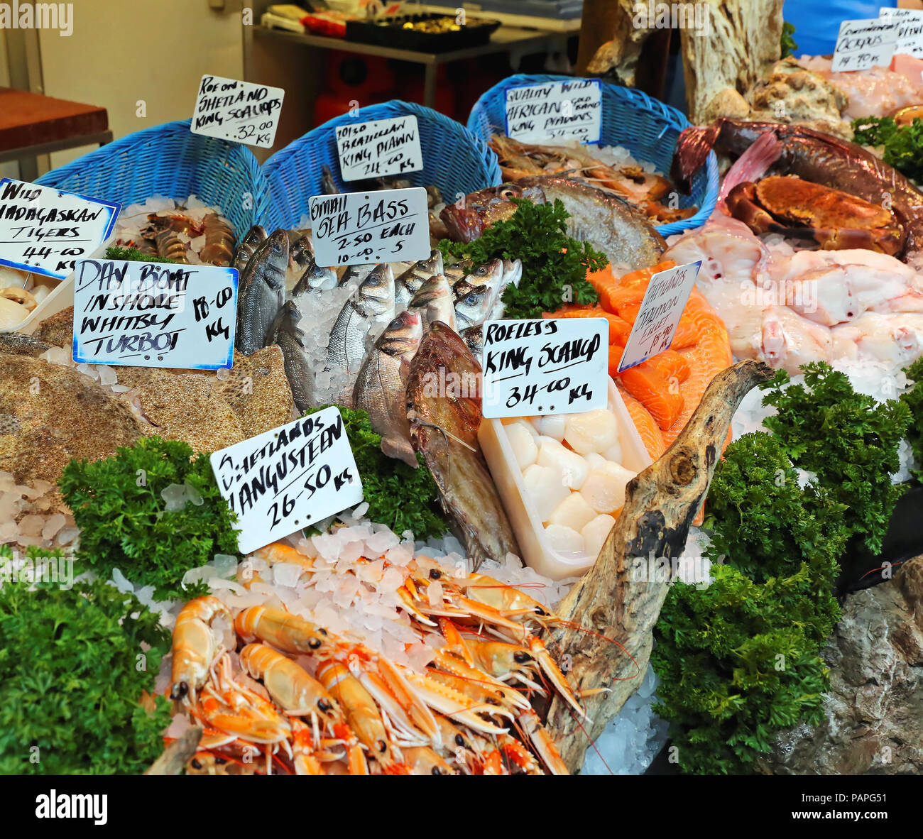 Fresh seafood at fish market stall Stock Photo - Alamy