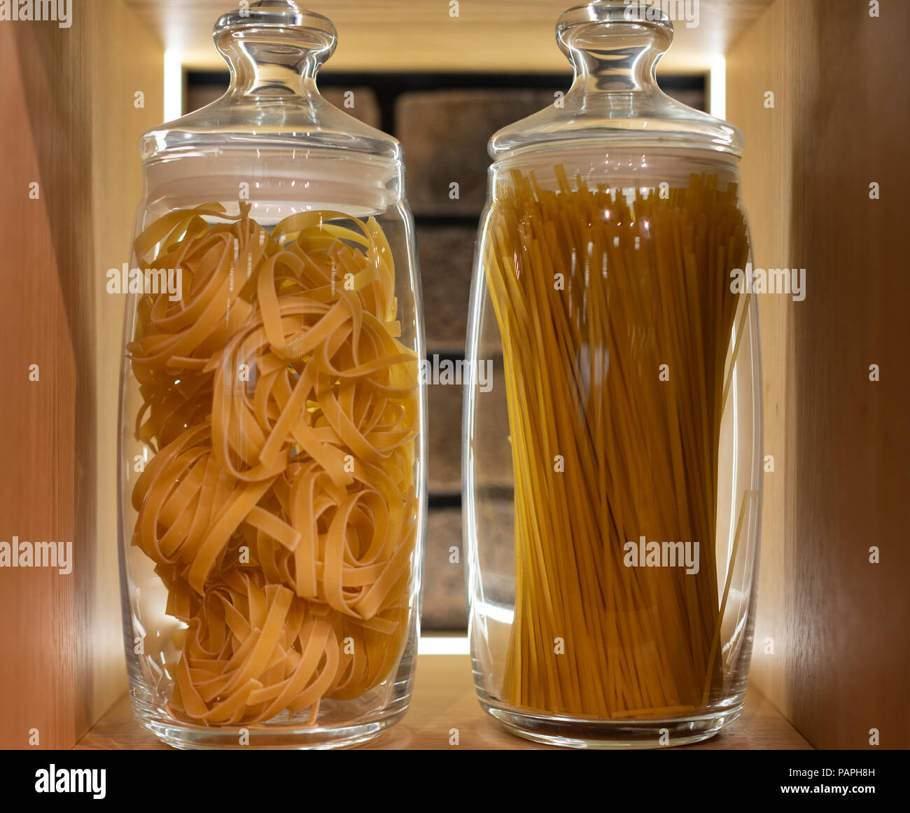 pasta and on a shelf in a glass jar in a modern interior Stock Photo ...