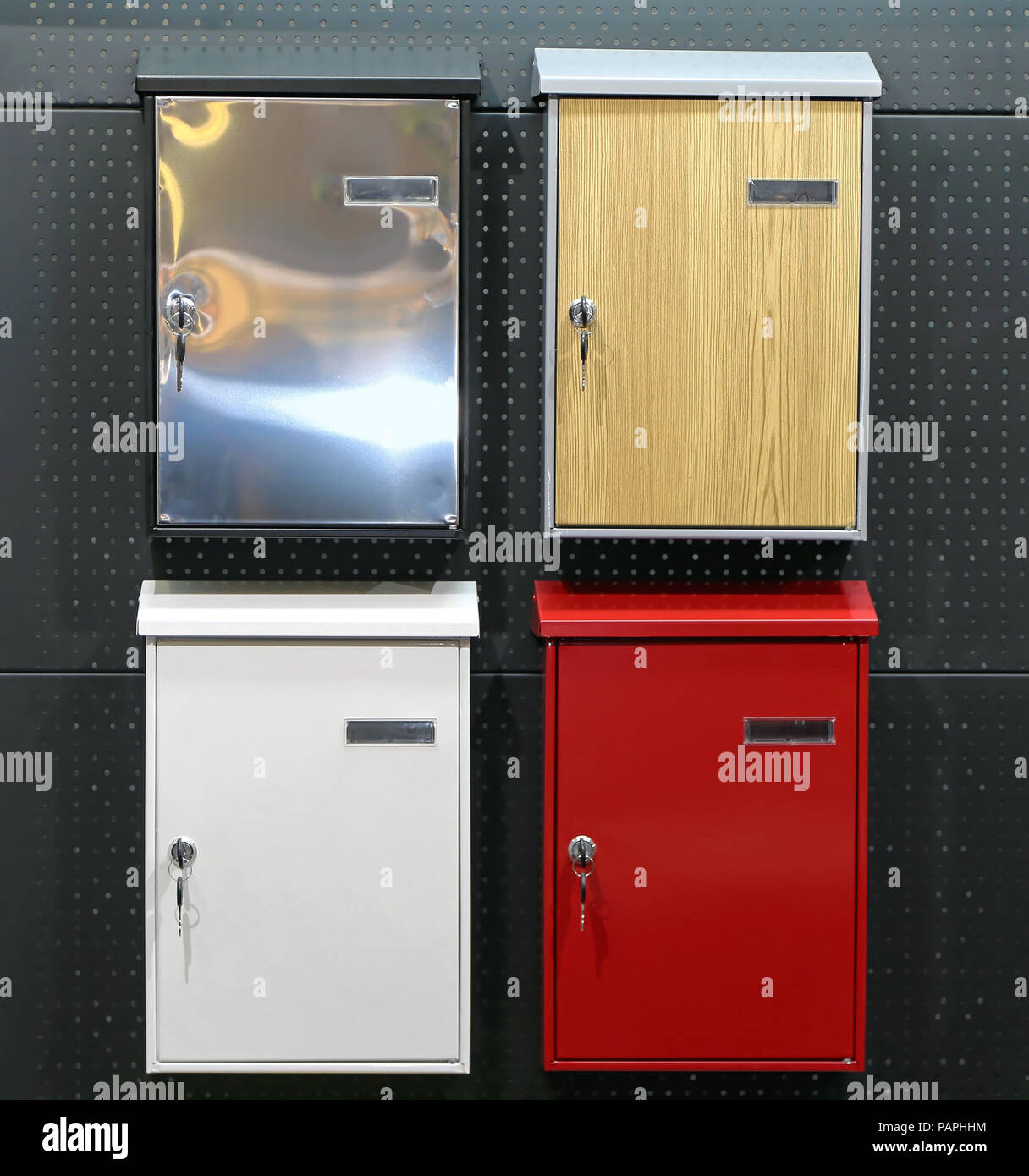 Four different mail boxes at wall Stock Photo - Alamy