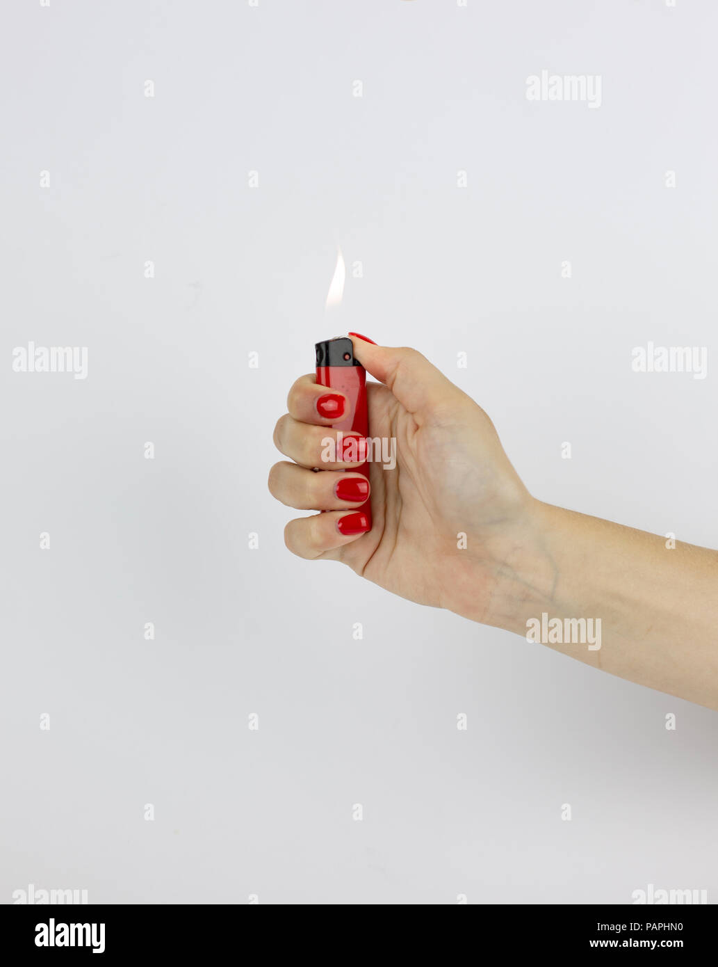 lighter with fire in woman's hand isolated on white background Stock ...