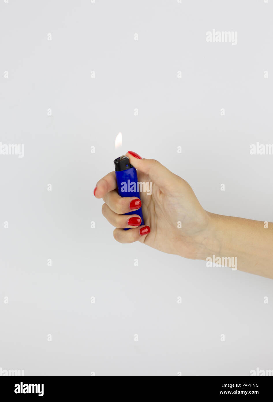 lighter with fire in woman's hand isolated on white background Stock ...