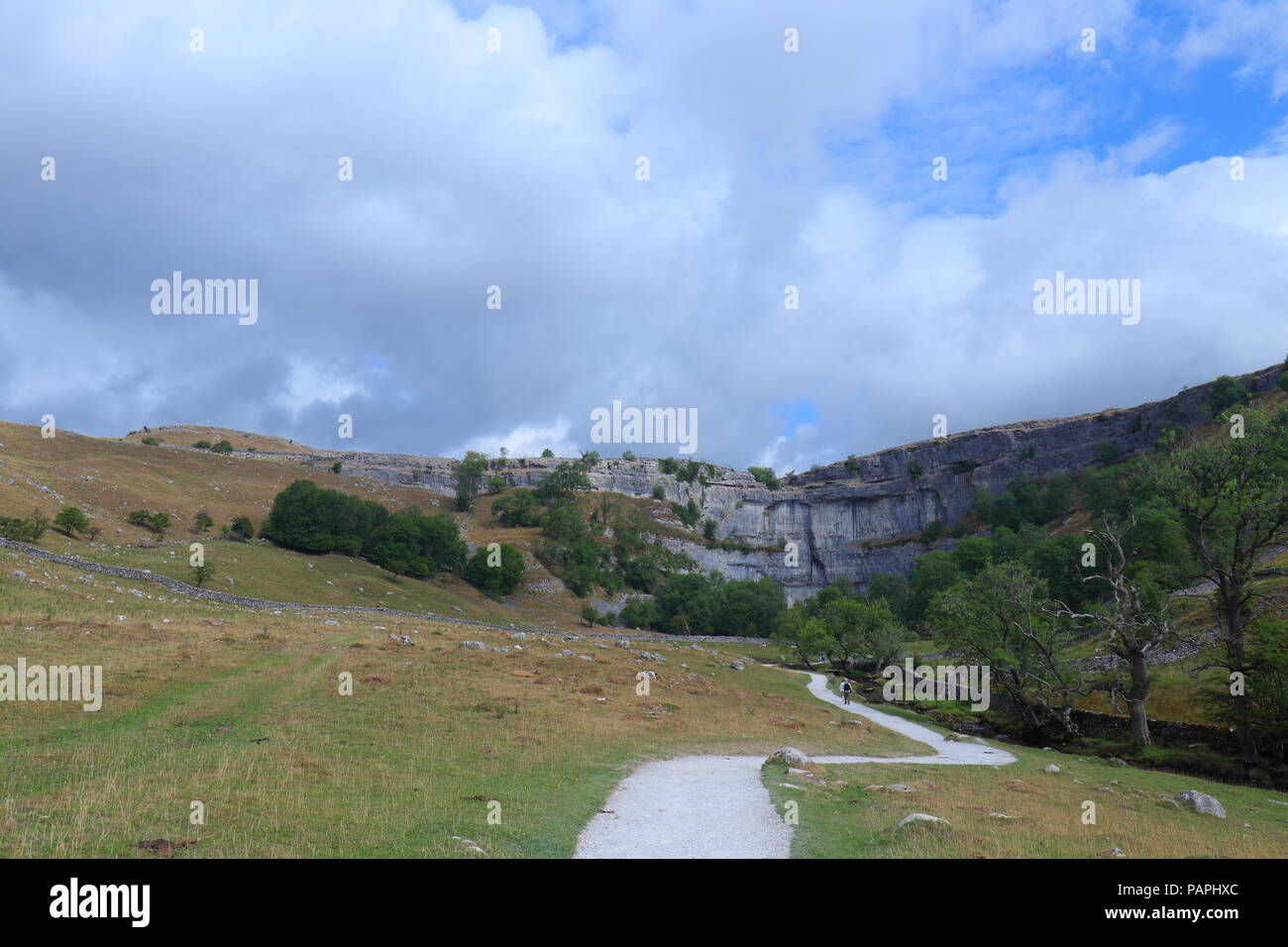 Looking towards the cliff face of Malham Cove in the Yorkshire Dales ...