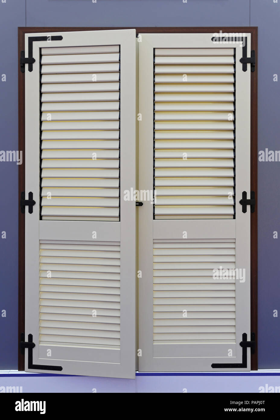 Closed double window shutters at house Stock Photo - Alamy