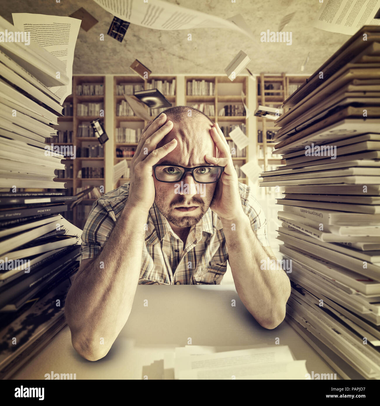 stressed student portrait in library Stock Photo - Alamy