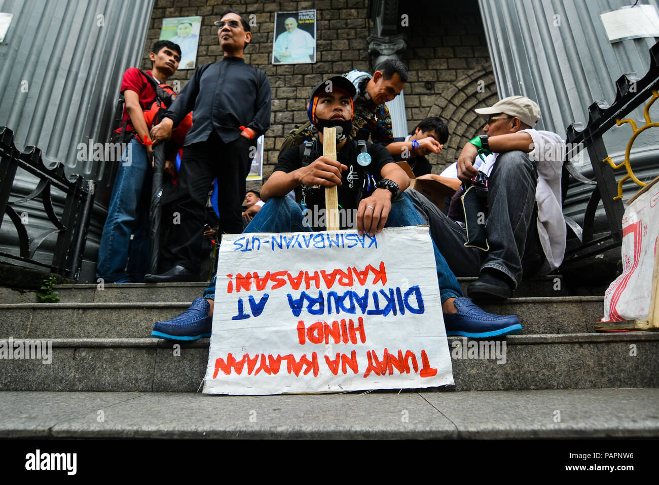 A protester is taking a rest at the footsteps of St. Peter Church in ...