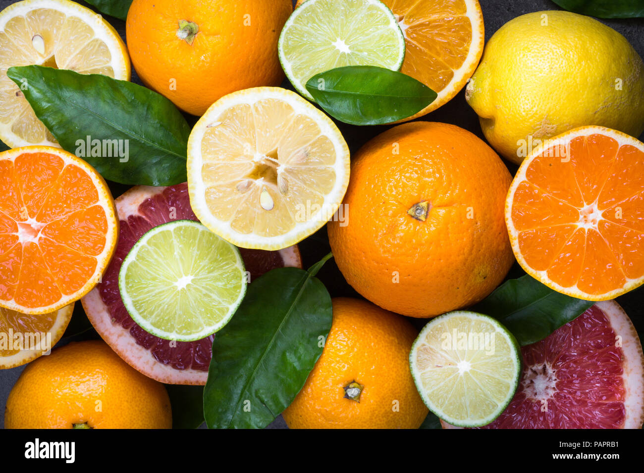 Fresh citrus fruit assortment. Whole and sliced citrus fruit. Fruit ...