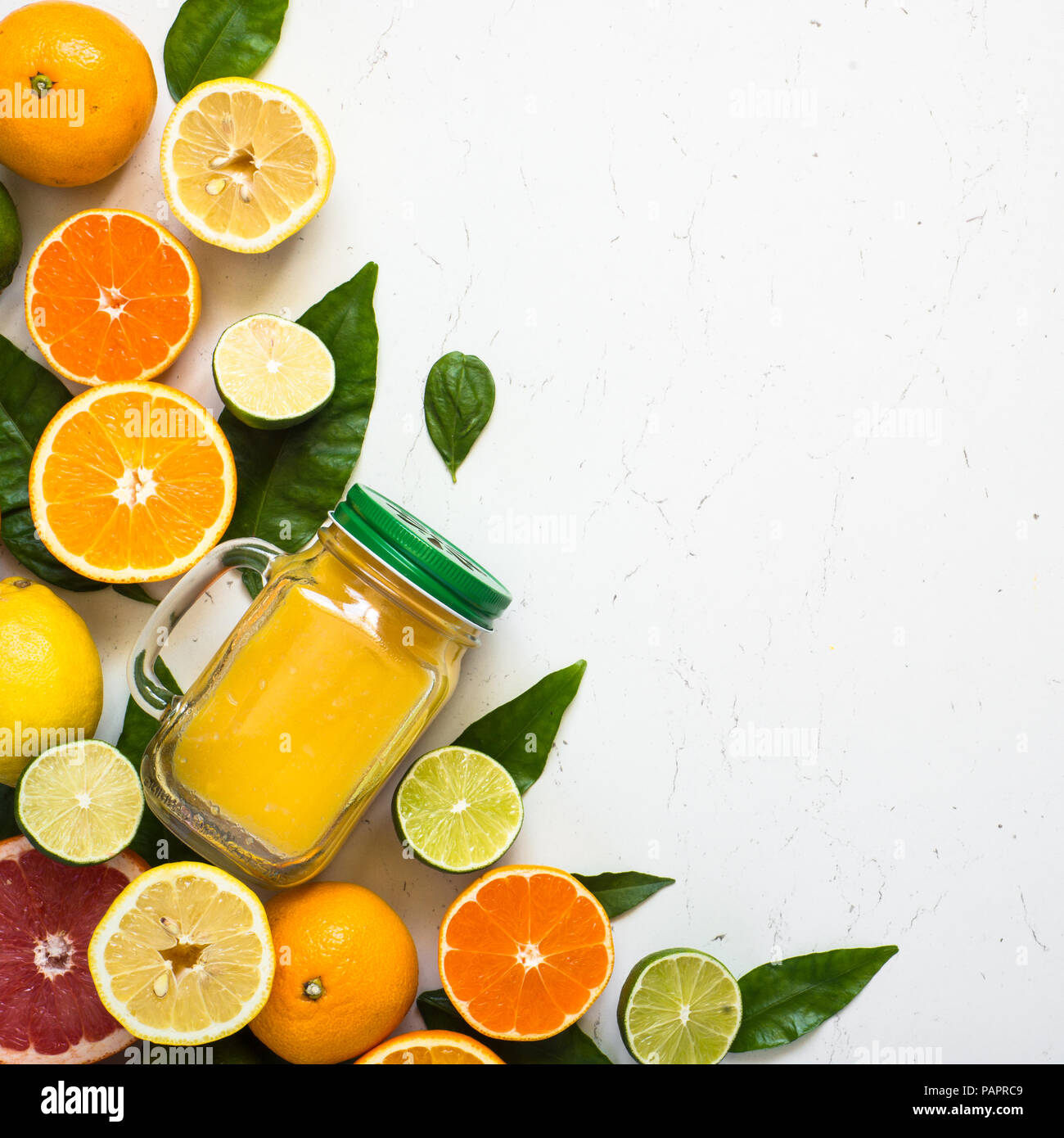 Citrus juice smoothie and ingredients on white. Fruit food background ...