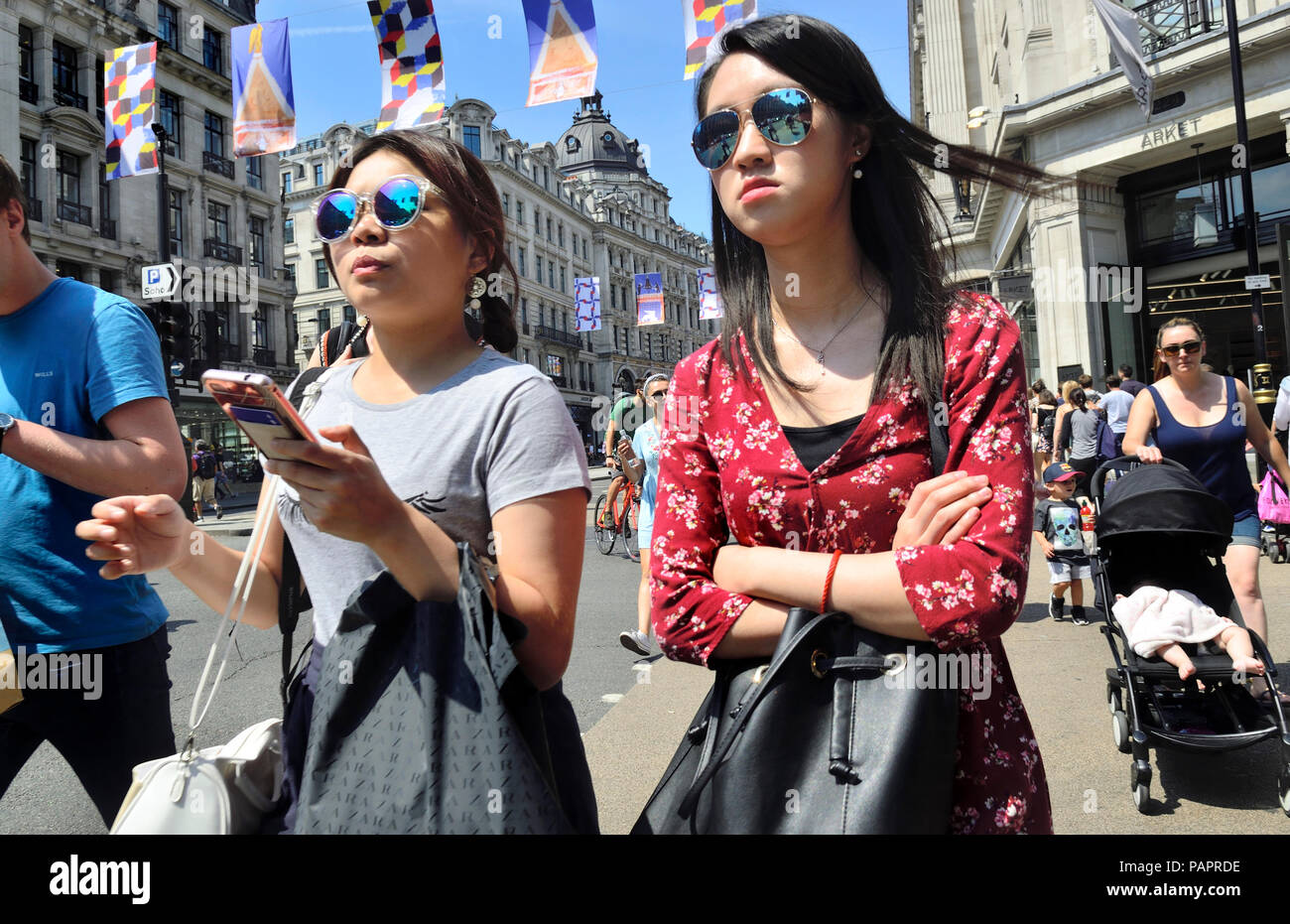 Asian tourists in Regent Street, London, England, UK Stock Photo - Alamy