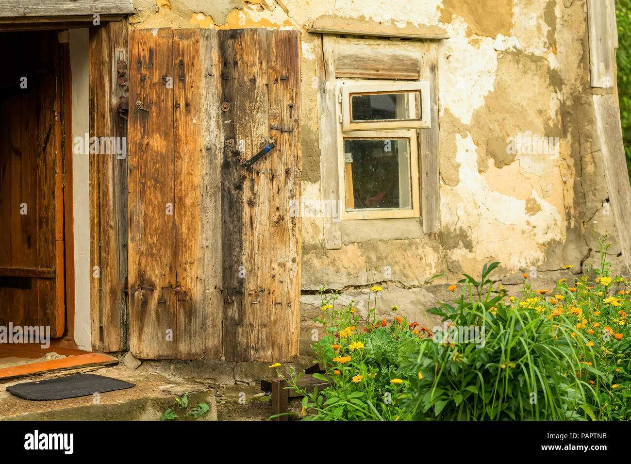 Old weathered rough wall with wooden window. Natural vintage dirty ...