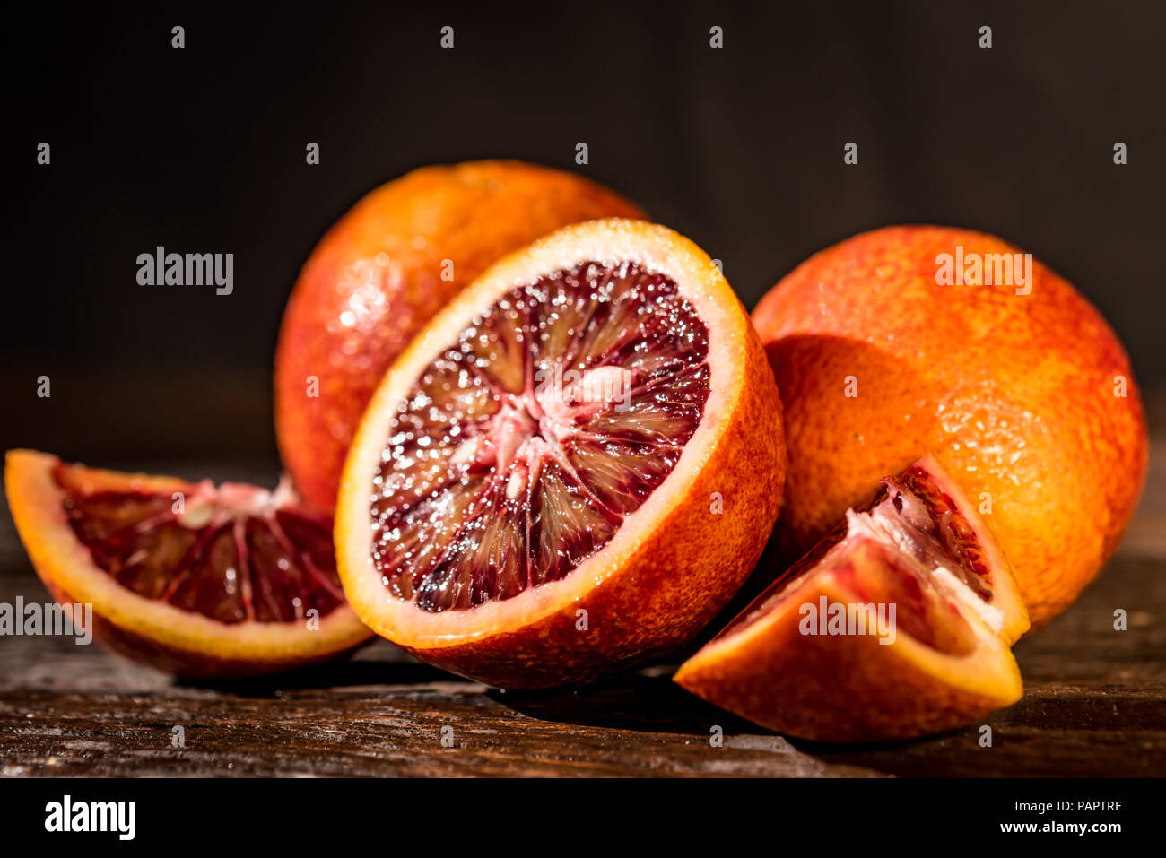 Whole and cut ripe juicy Sicilian Blood oranges Stock Photo - Alamy