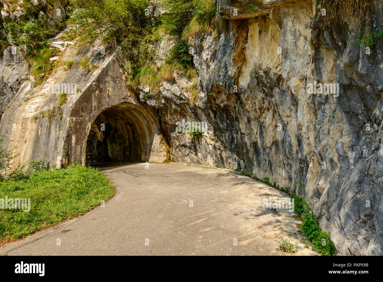 rock tunnel entrance on previous narrow mountain road now made into ...