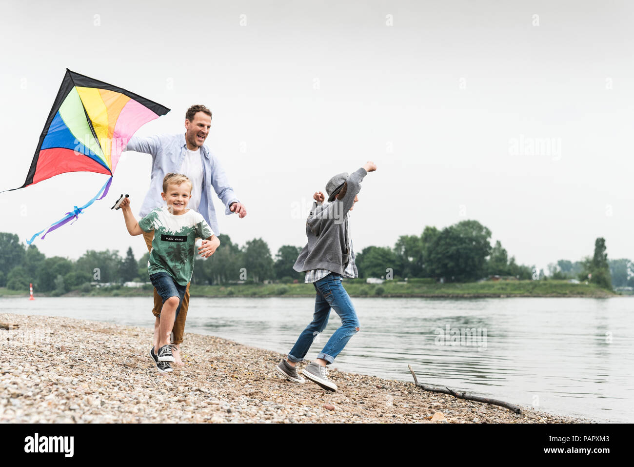 Two boys fly kite hi-res stock photography and images - Alamy