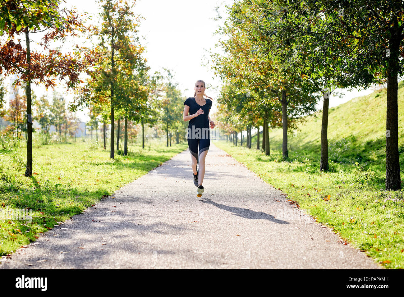 Female running back view full length hi-res stock photography and ...