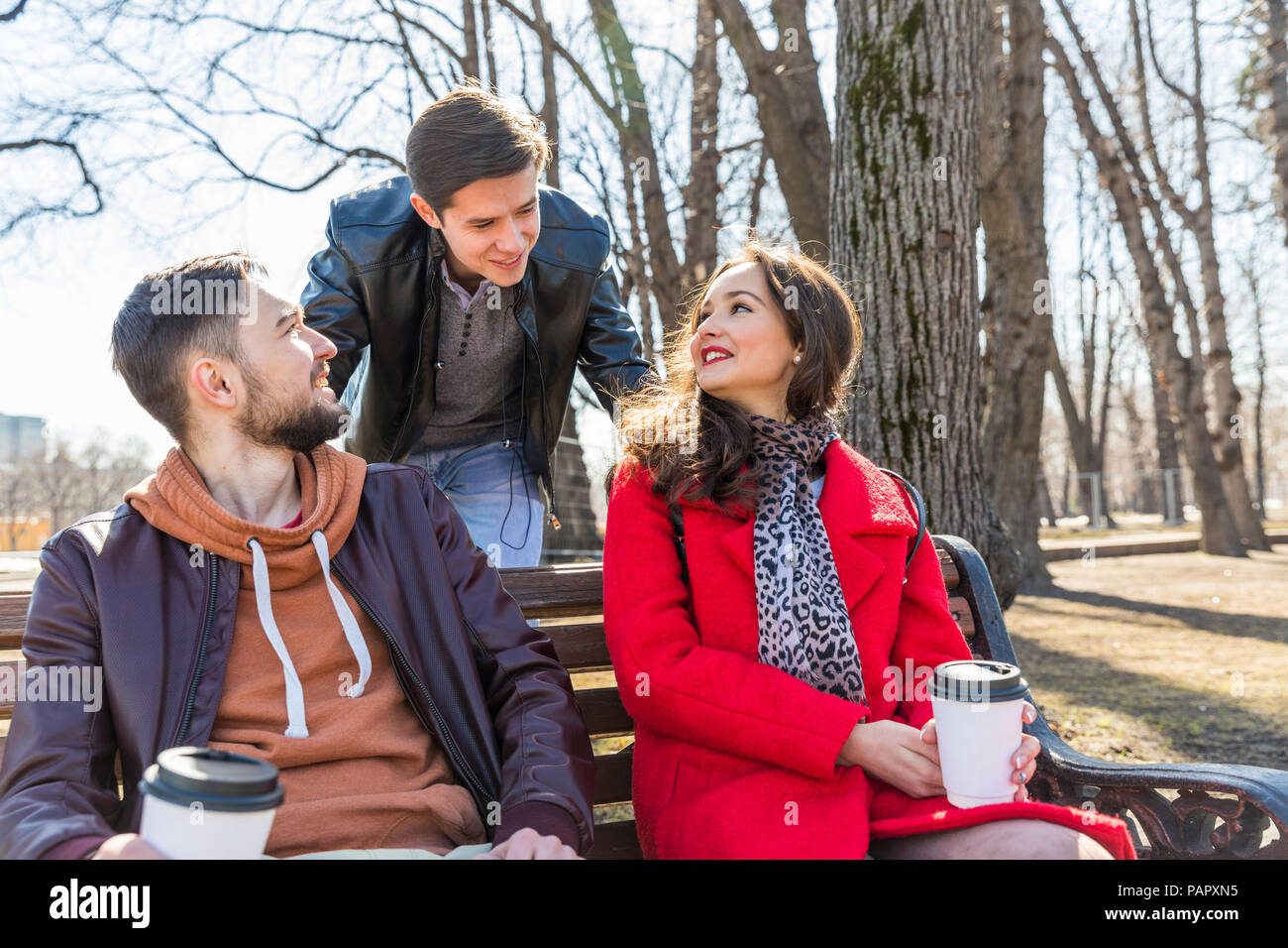 Russia, Moscow, group of friends at park, having fun together, drinking ...