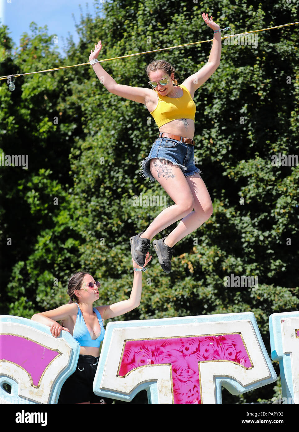 Festival-goers take advantage of the hot weather at the 50th Isle of ...