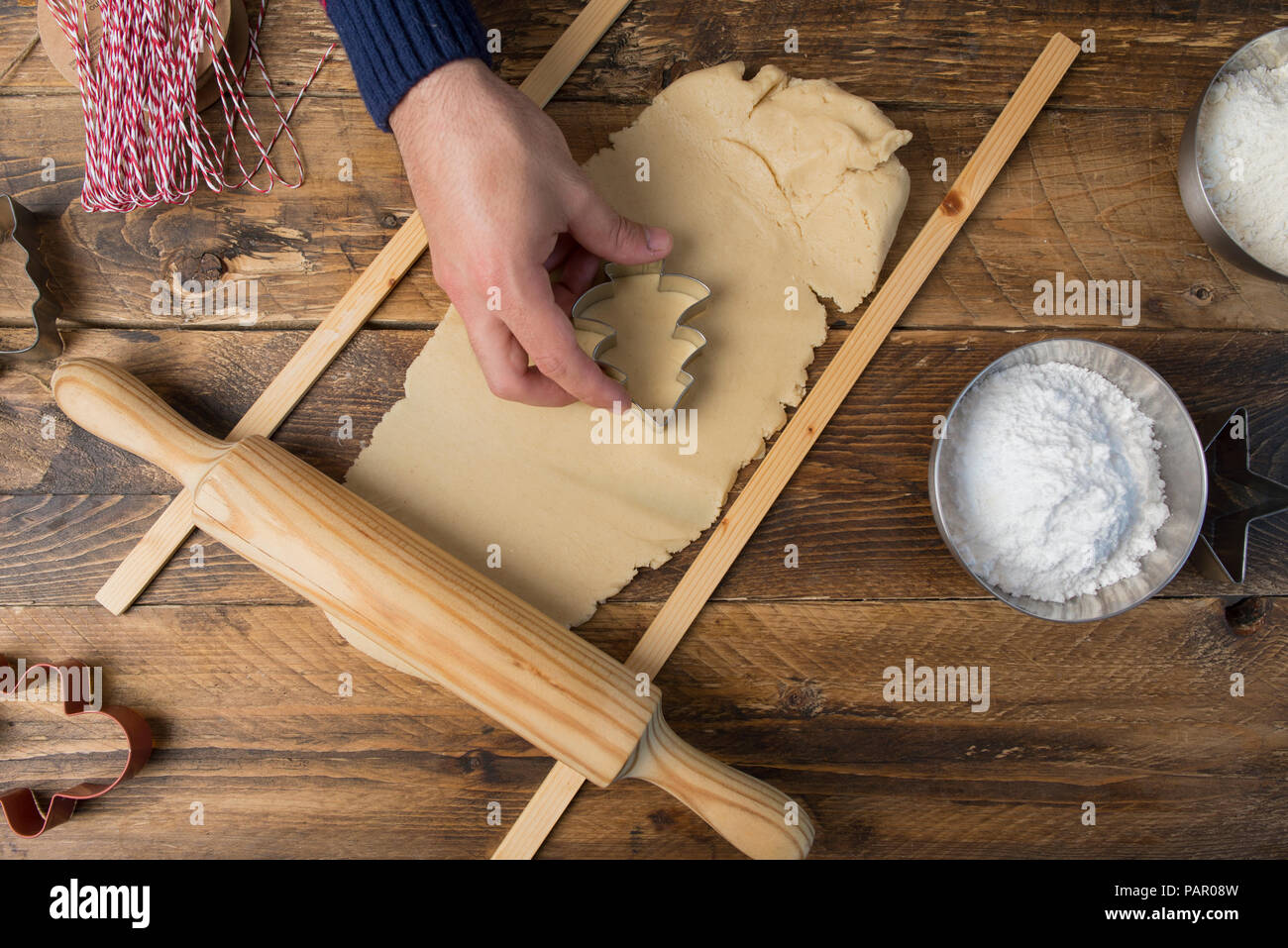 Making christmas cookies with mold Stock Photo - Alamy