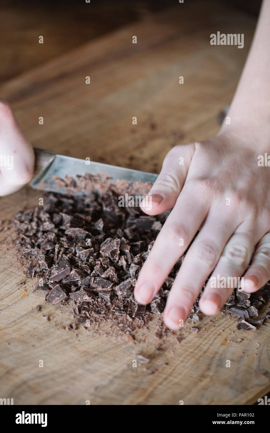Womans hand chopping bitter chocolate hi-res stock photography and ...