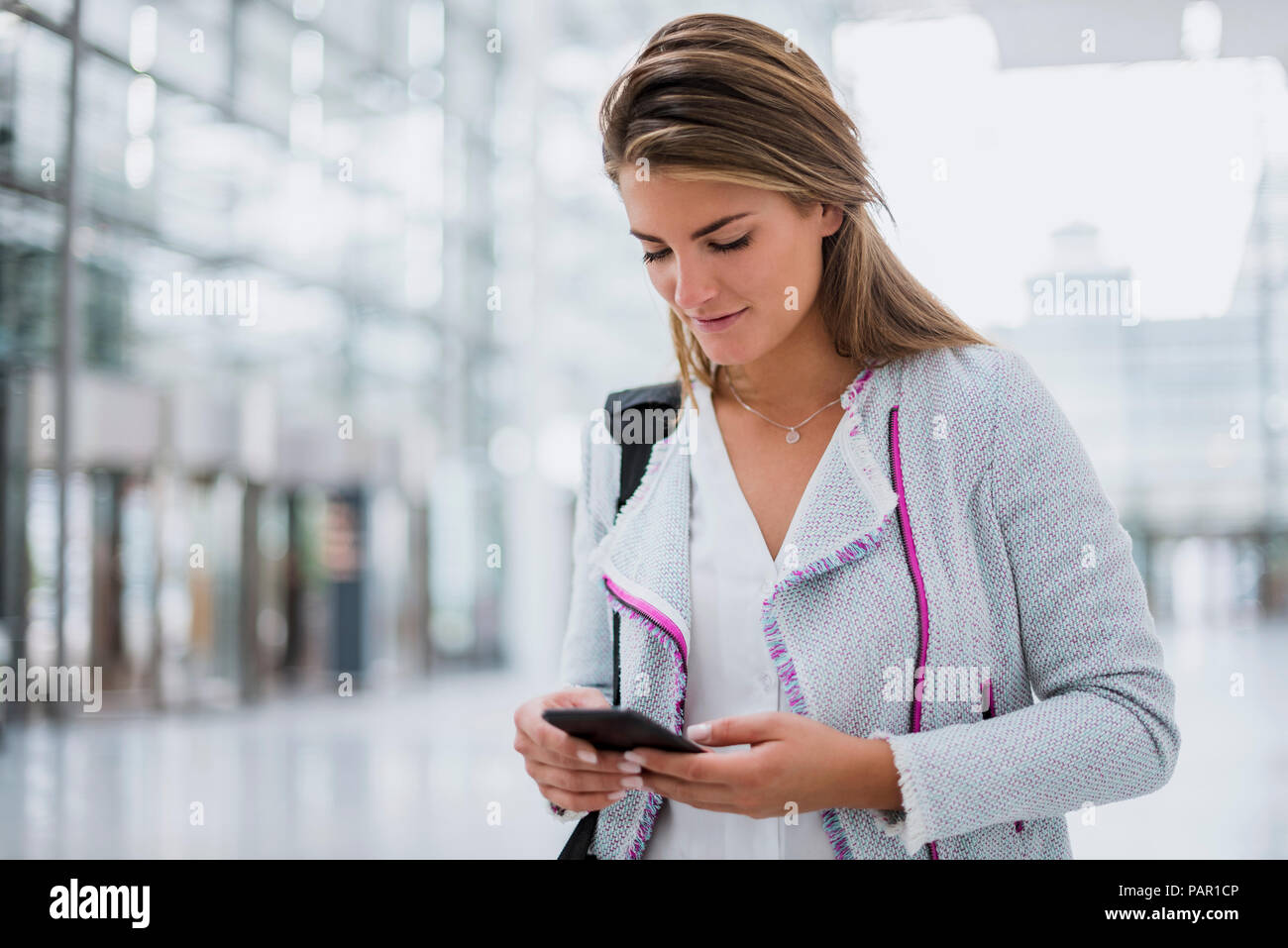 Female traveler using cell hi-res stock photography and images - Alamy