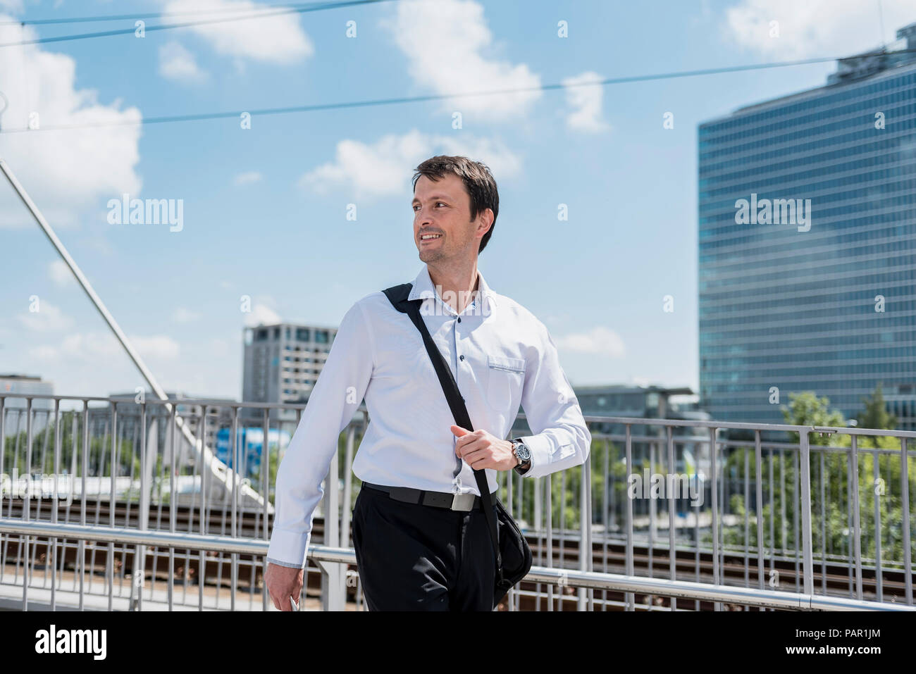 Man walking on bridge side view hi-res stock photography and images - Alamy