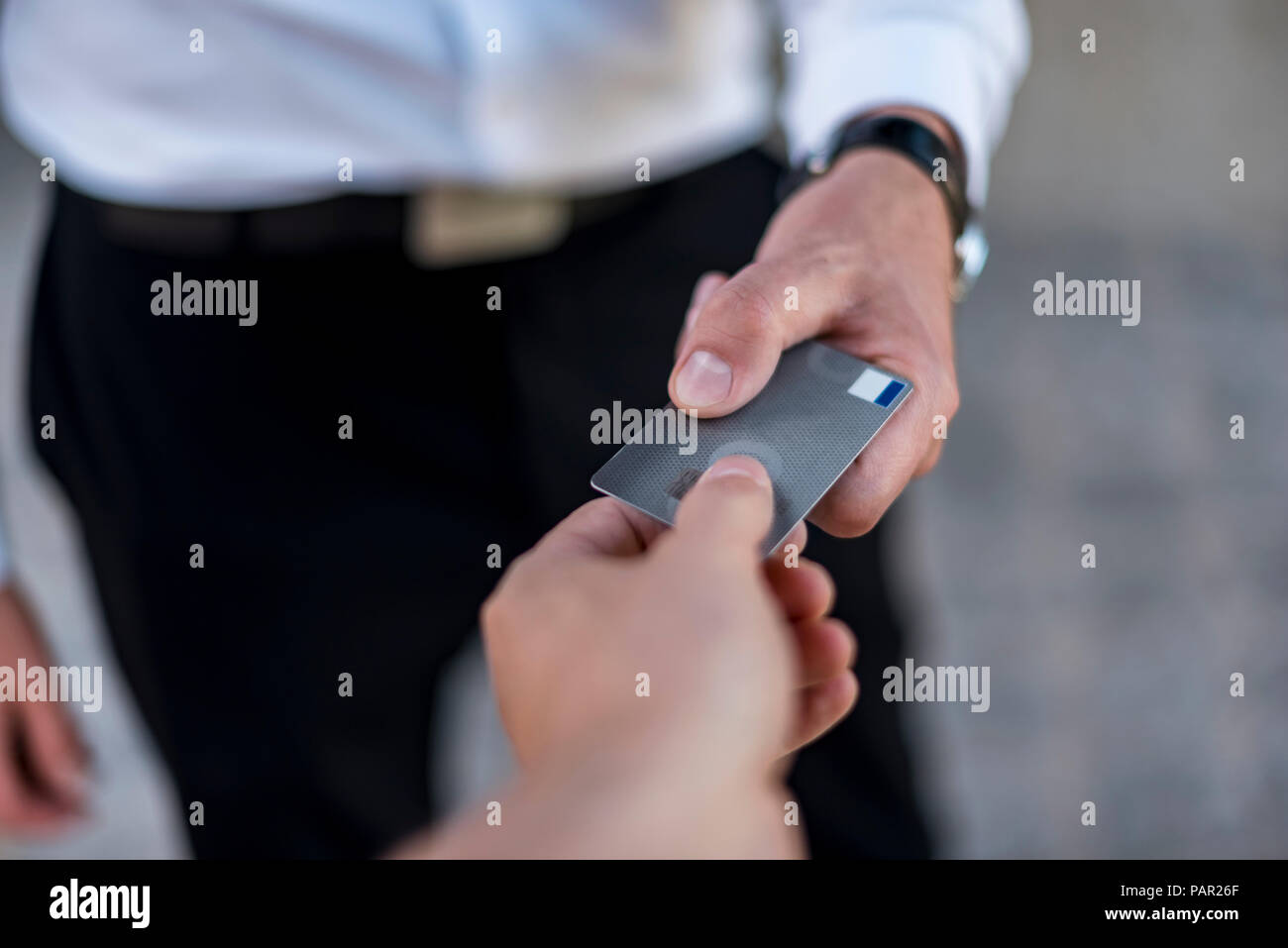 Handing hi-res stock photography and images - Alamy