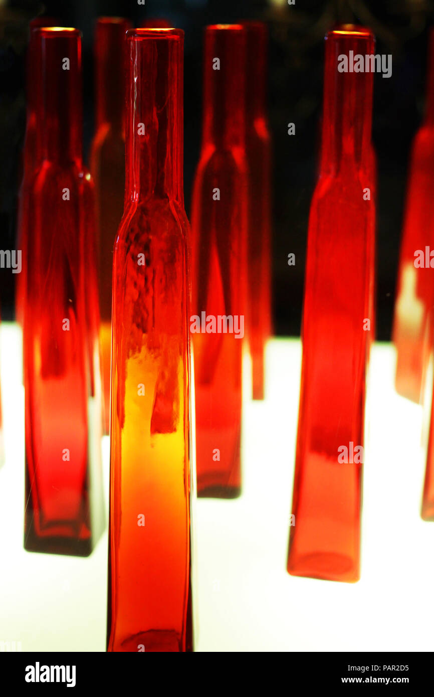 many red glass vase put on the light shelf make the interesting ...