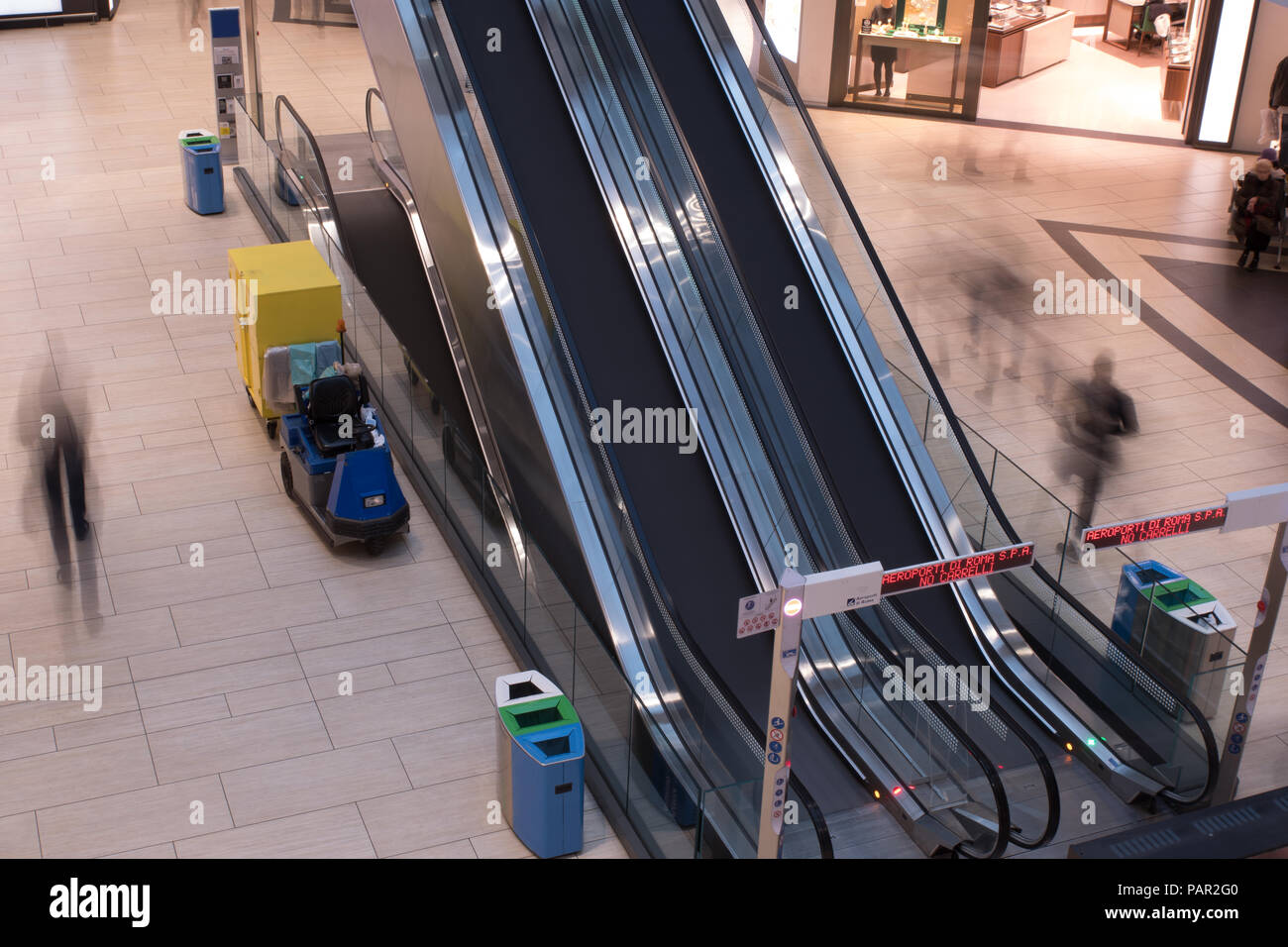 A Long exposure photograph of two escalators in Rome Airport terminal ...