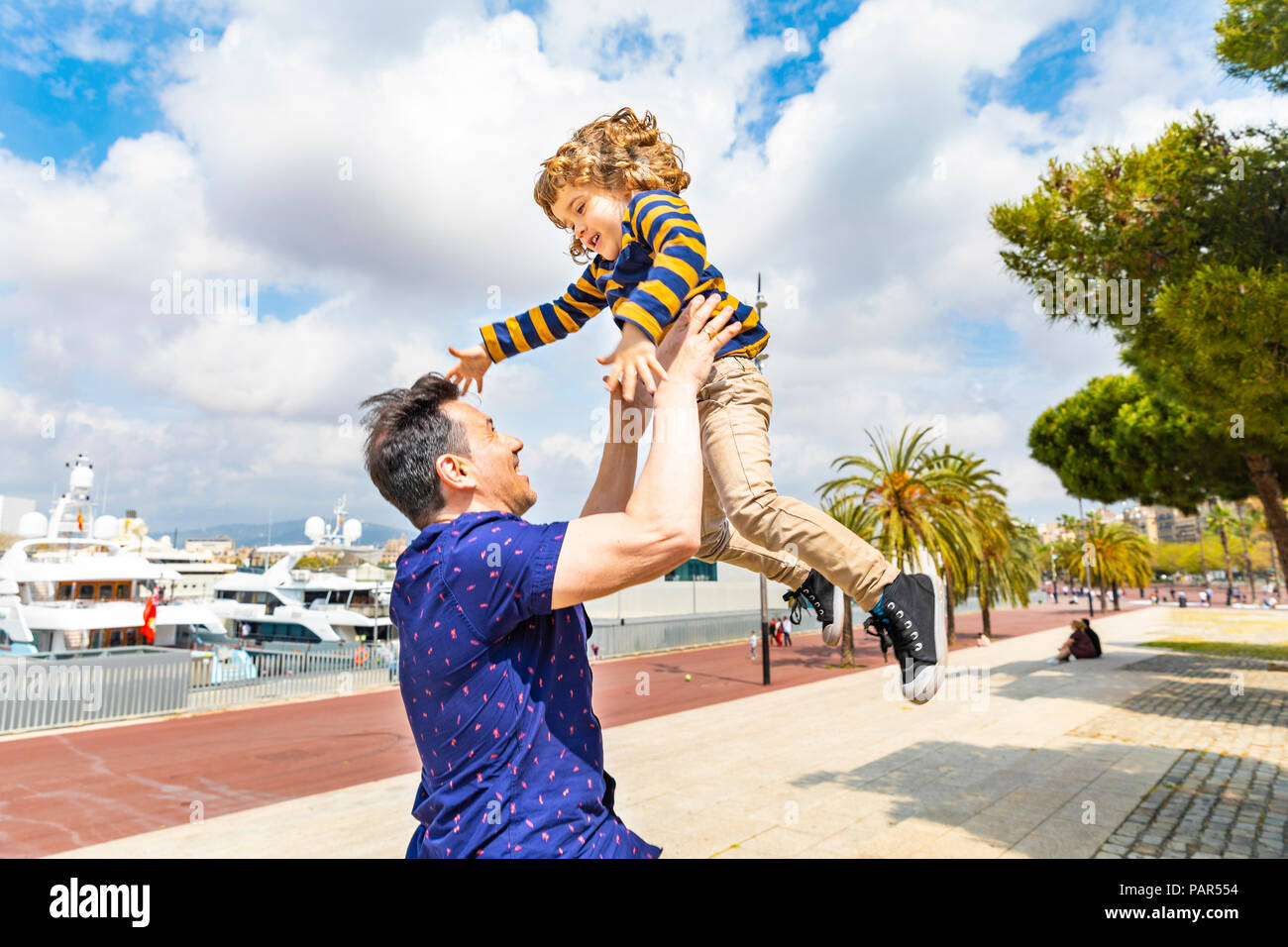Spain, Barcelona, father and son playing together and having fun Stock ...