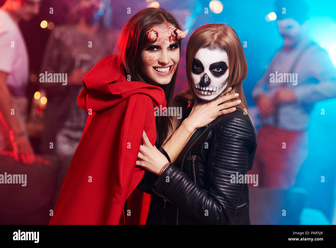 Women in creepy costumes dancing at Halloween party Stock Photo - Alamy