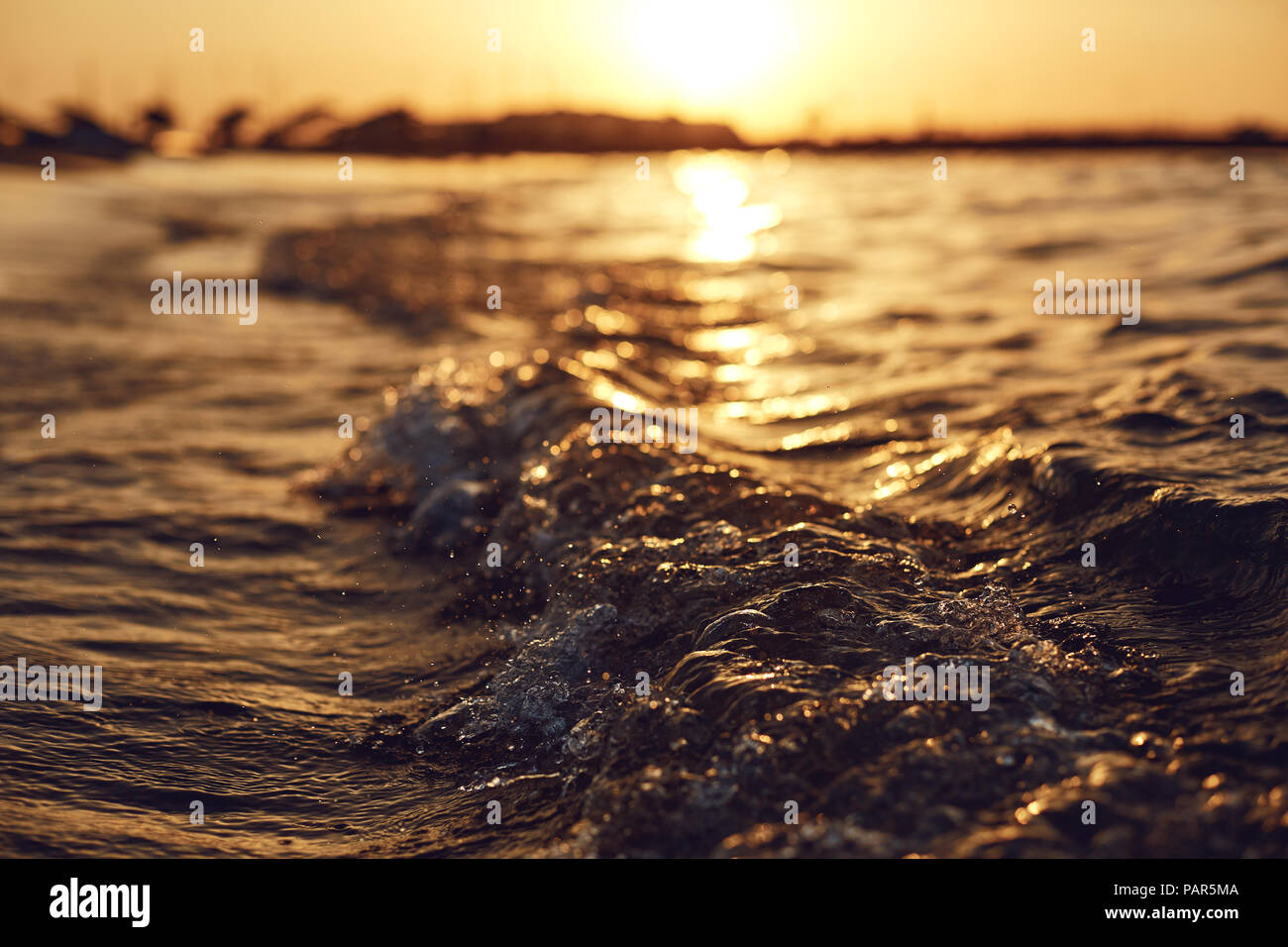 Sea wave on beach sunset hi-res stock photography and images - Alamy