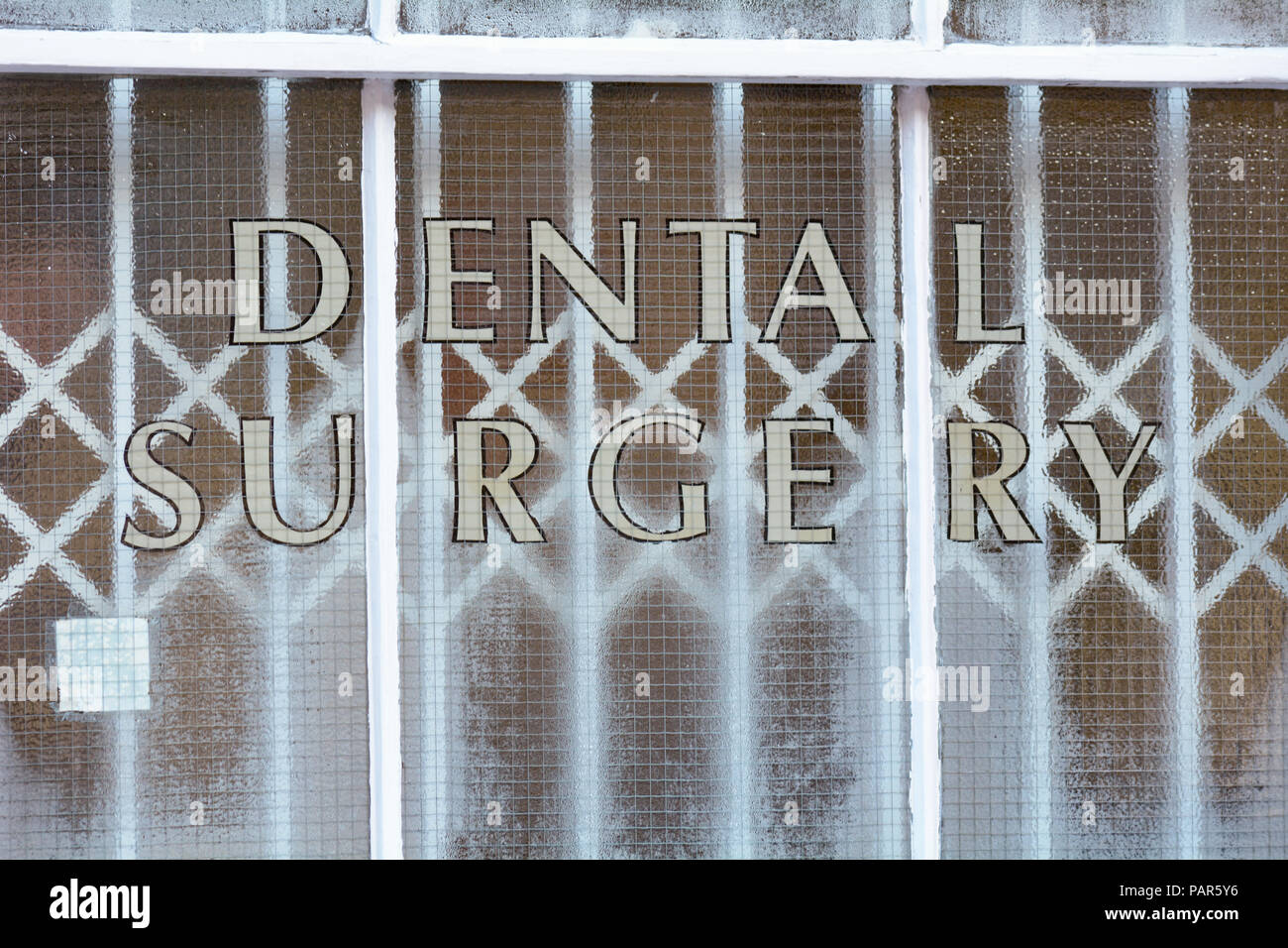Dental Surgery sign embossed on window Stock Photo - Alamy