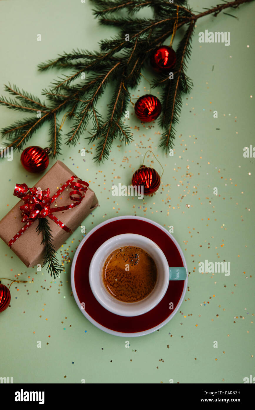 Delicious fresh morning winter festive espresso coffee in a green mug ...