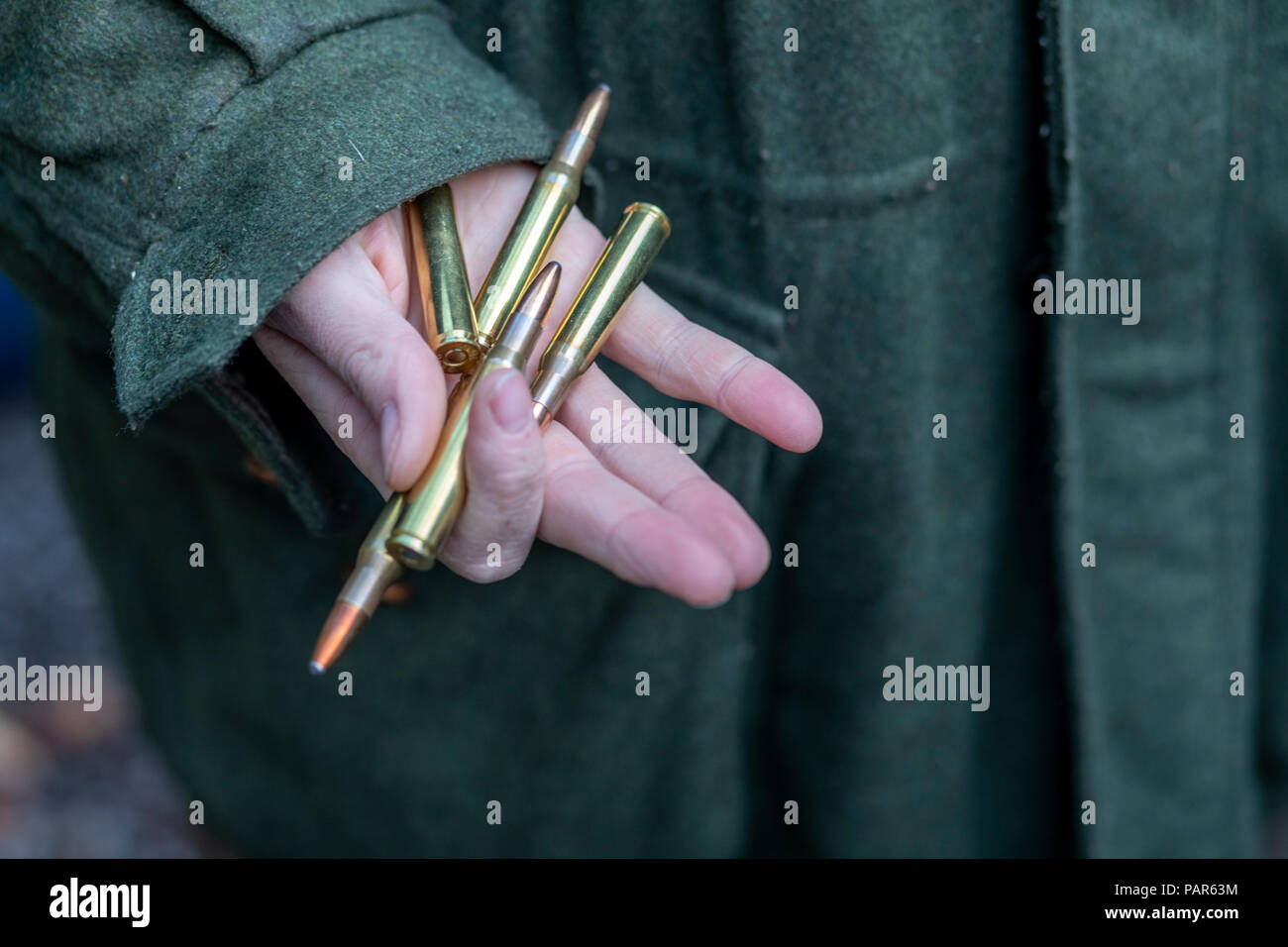 Hand holding rifle hi-res stock photography and images - Alamy