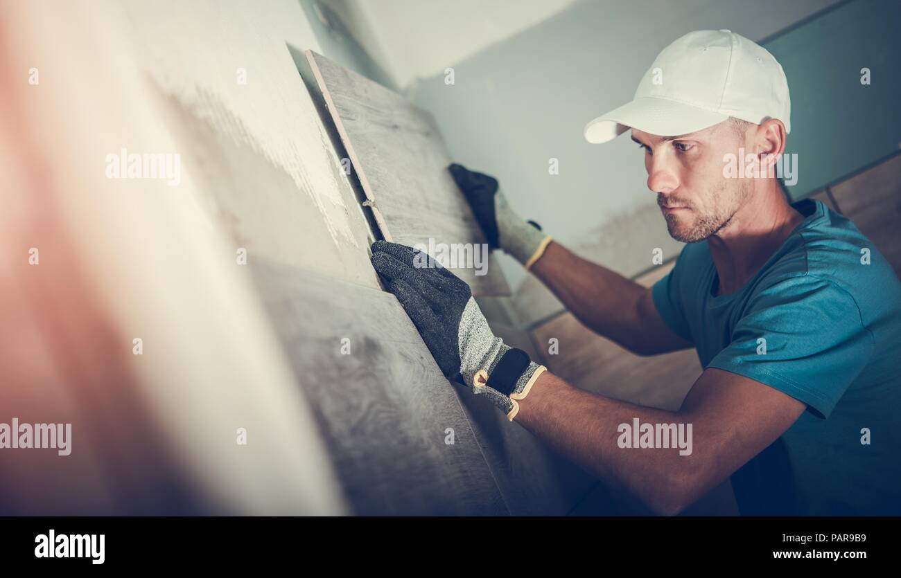 Contractor installing ceramic tiles hi-res stock photography and images ...