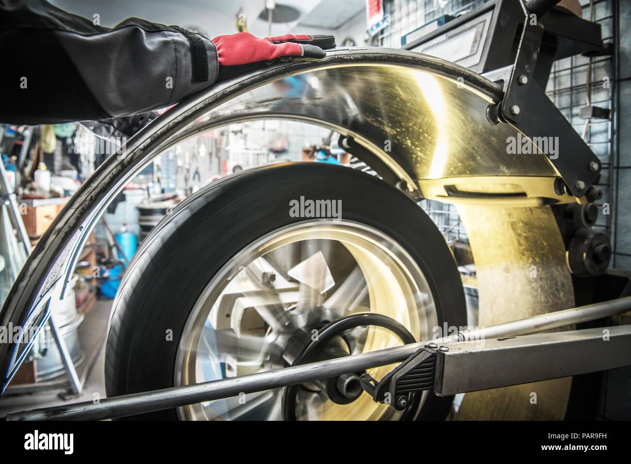 Car Wheel Balancer in Action. Vehicle Tire Wheel Balancing in the Auto ...