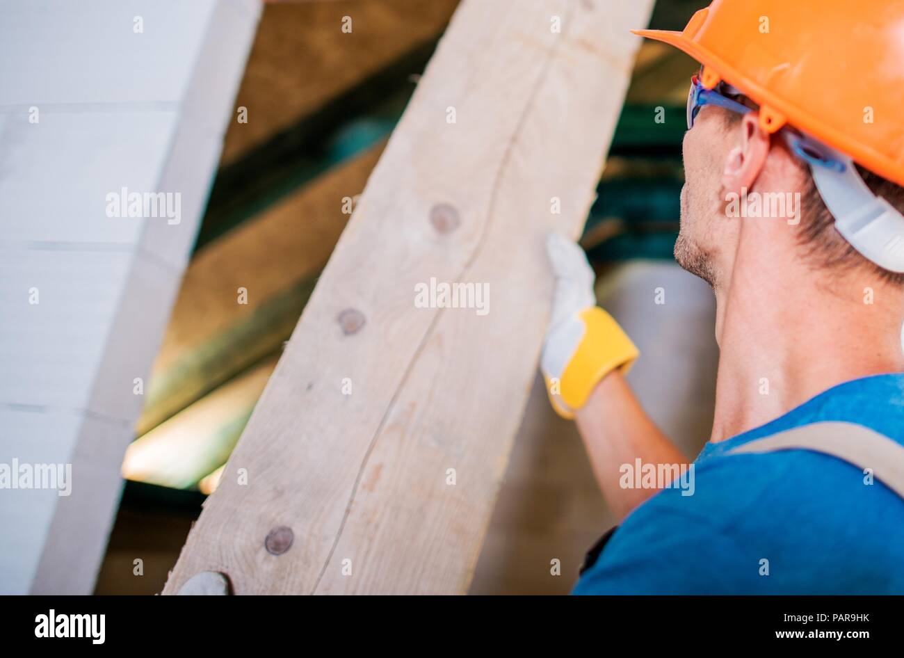 Construction Worker with Wood Board Closeup Photo. Construction ...