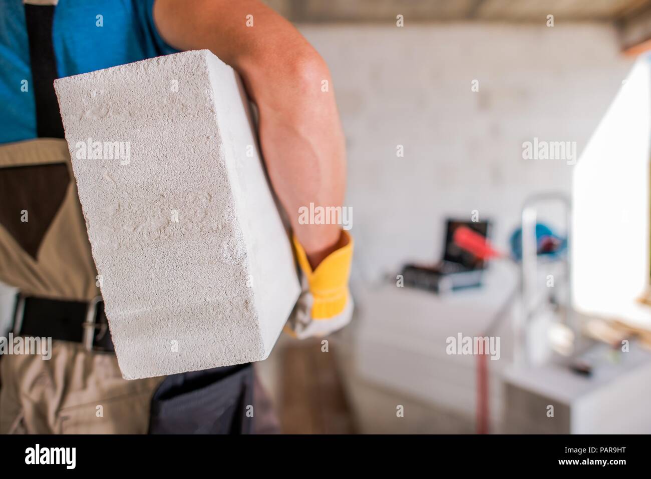 Caucasian Contractor in His 30s with Concrete Block in His Hand ...