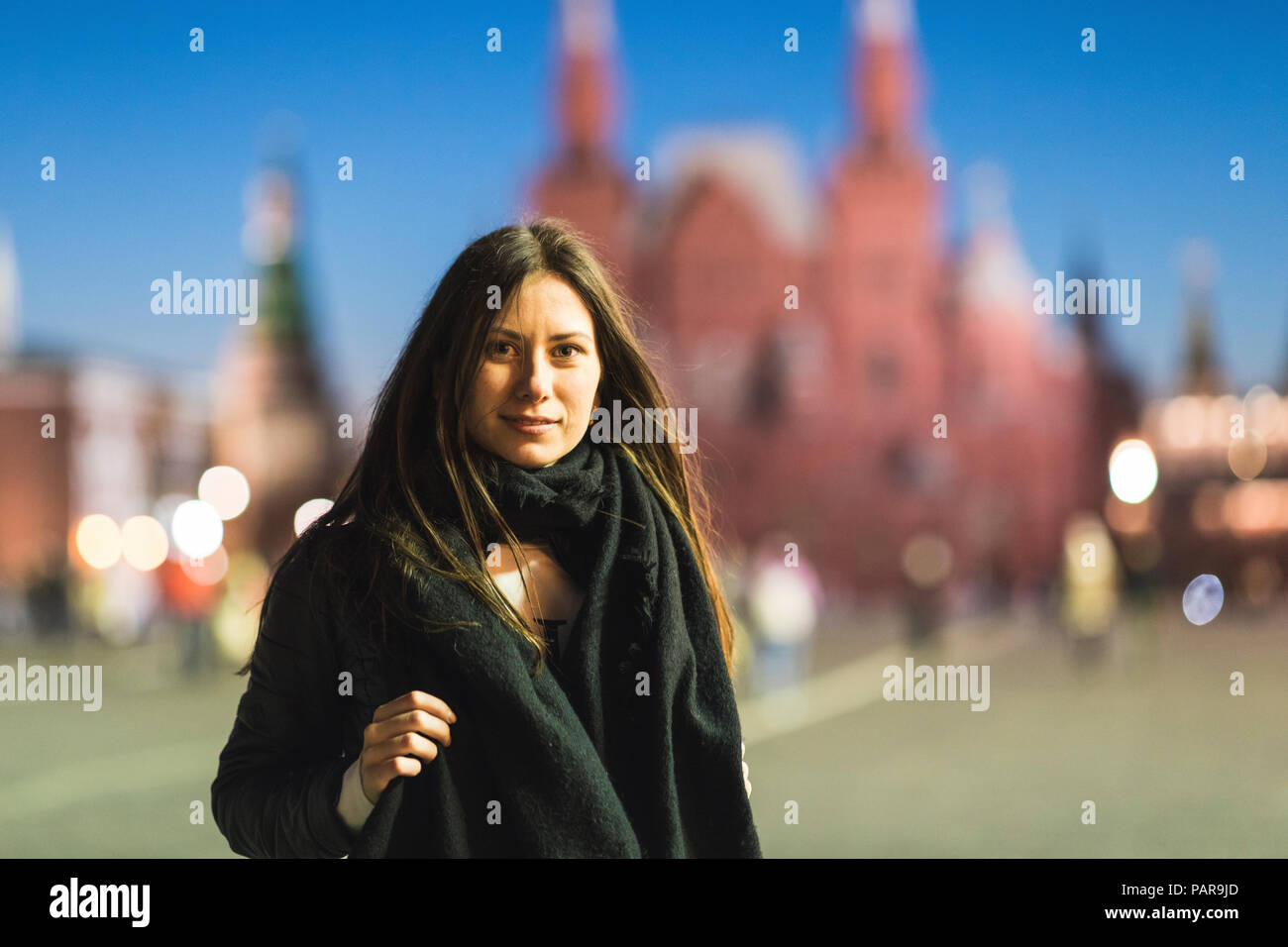Russia, Moscow, young woman visiting Red Square at night Stock Photo ...