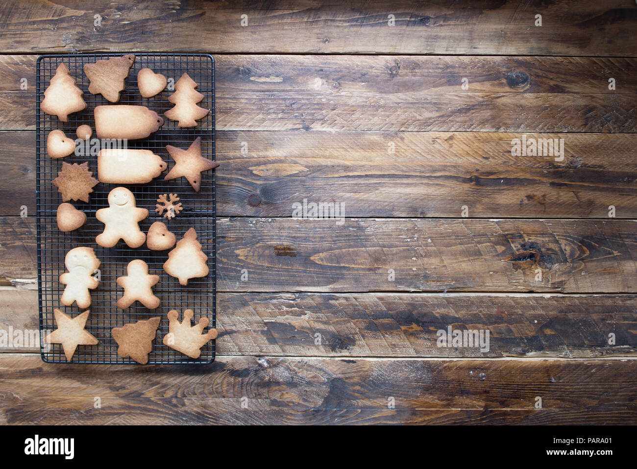 Various home-baked gingerbread cookies on cooling grid Stock Photo - Alamy