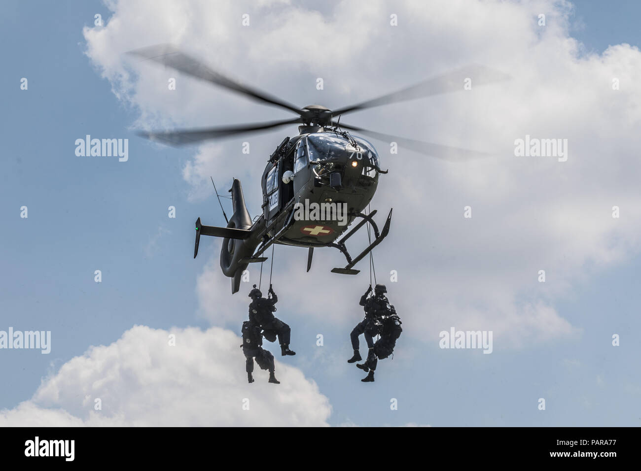 Special unit of police in exercise with helicopter, rescue team ropes ...