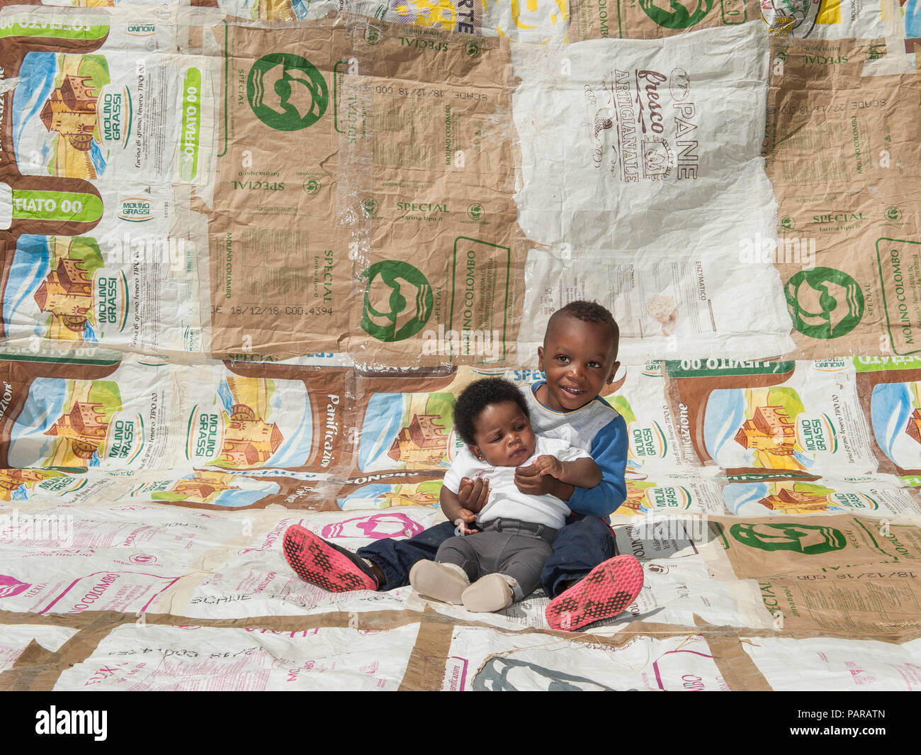 Italy, Cozzo, fleeing families Stock Photo - Alamy