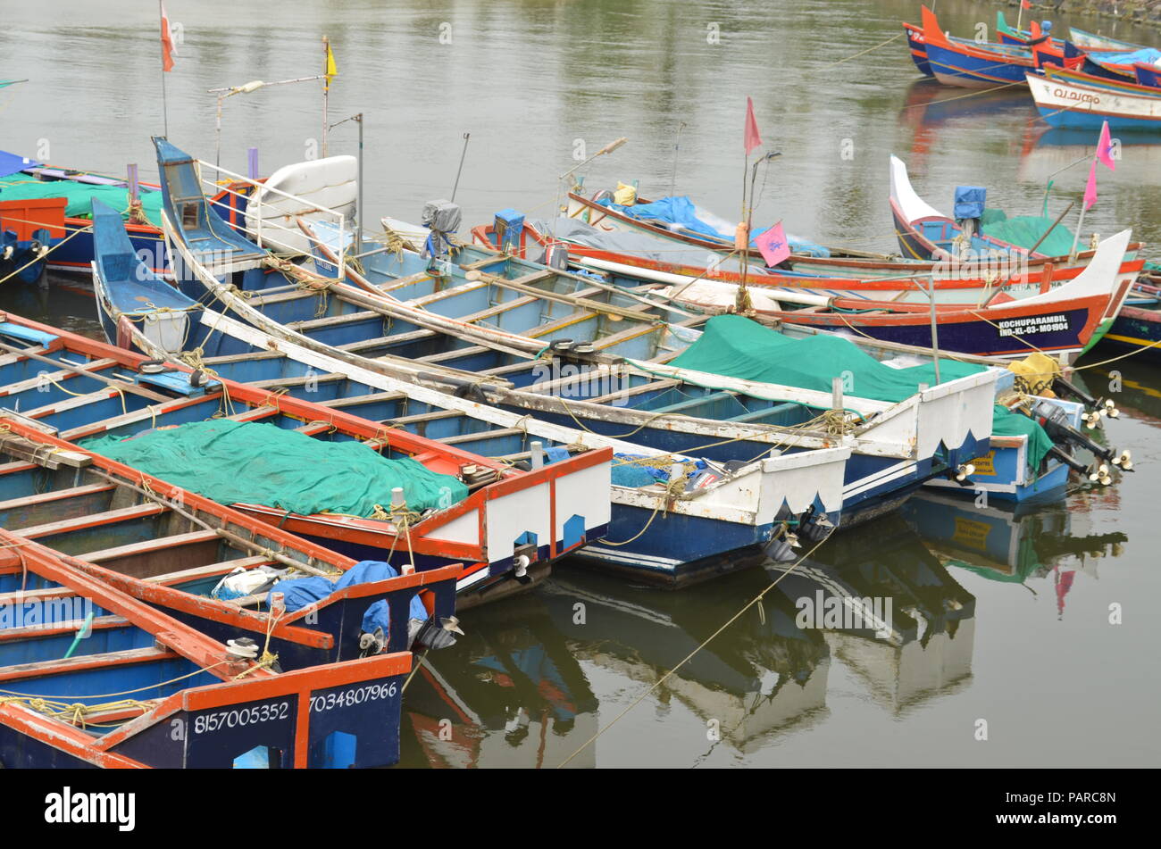 Many crowded fishing boats Stock Photo - Alamy