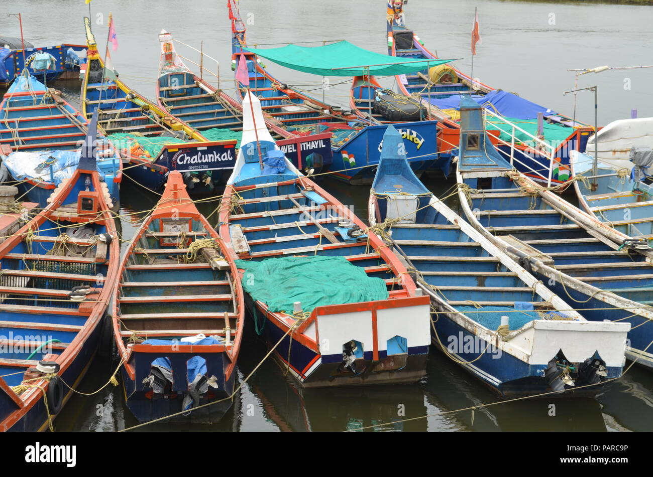 Many crowded fishing boats Stock Photo - Alamy