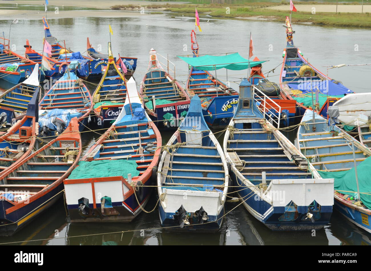 Many crowded fishing boats Stock Photo - Alamy