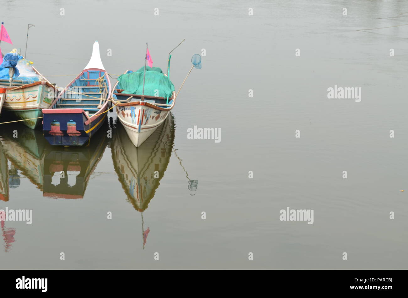 Many crowded fishing boats Stock Photo - Alamy