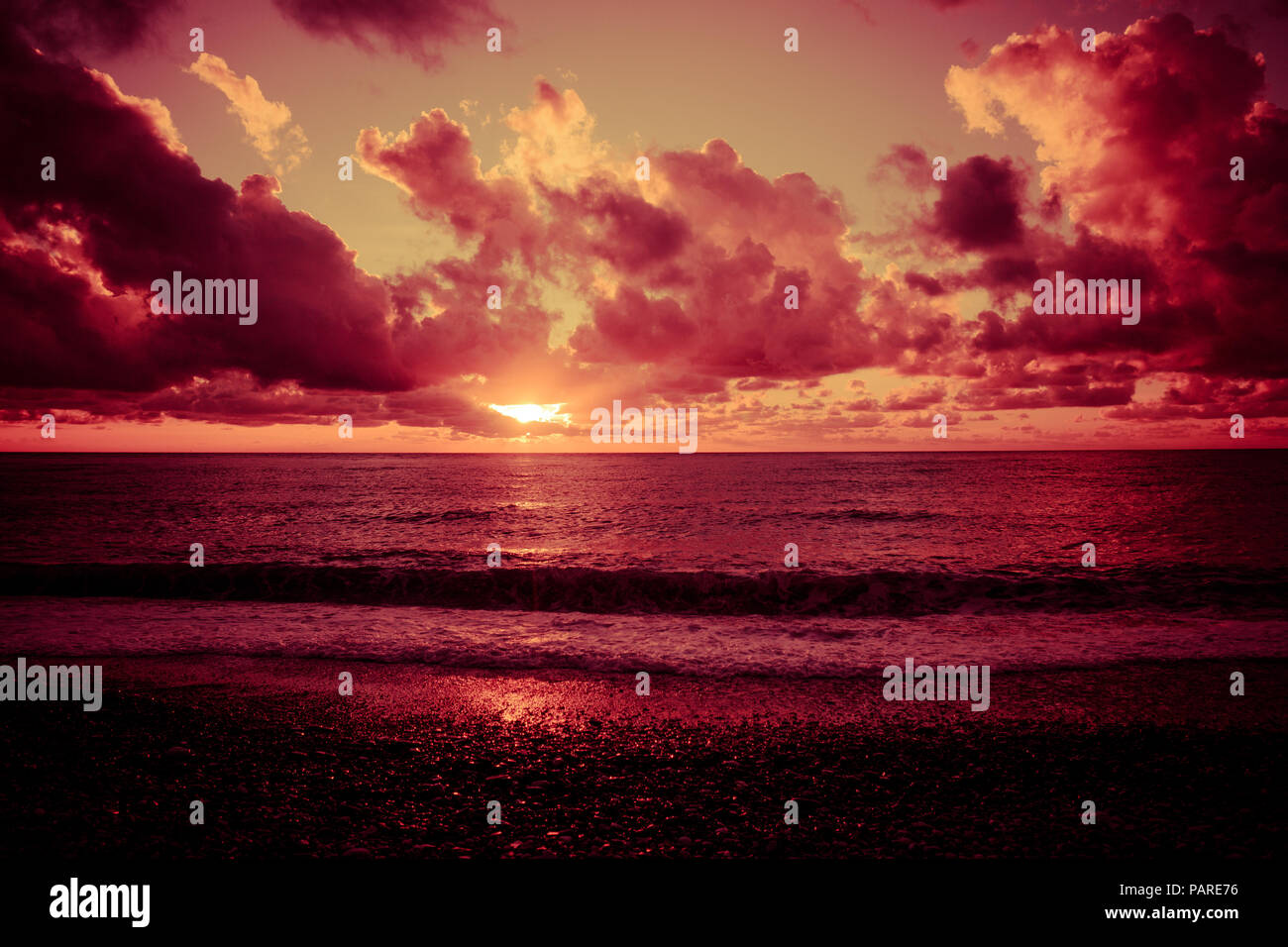 Colorful sunset over ocean Stock Photo - Alamy