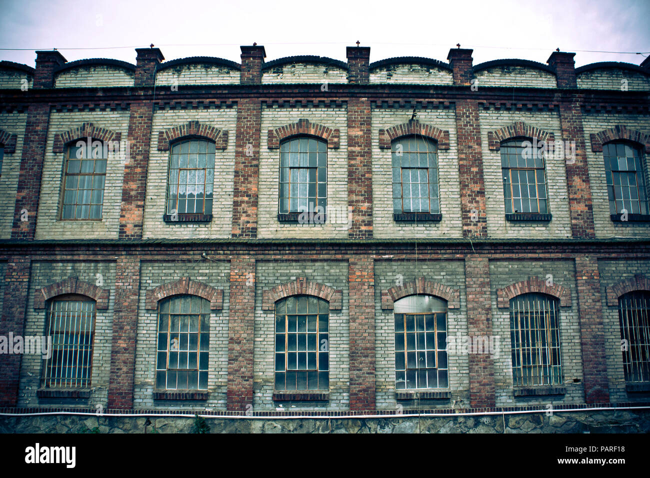 rows of windows of an old abandoned building Stock Photo - Alamy